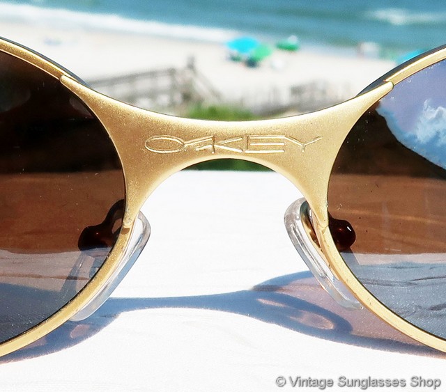 Oakley E Wire Gold Titanium Chrome Iridium Sunglasses